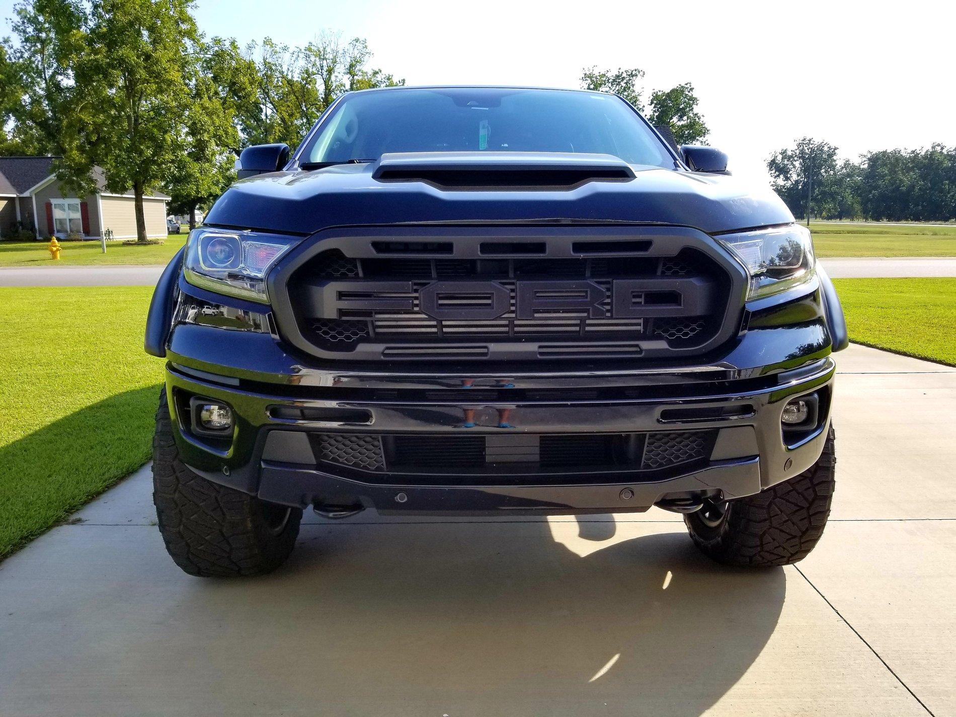 Air design hood scoop, smooth bushwacker flares, raptor grille ...